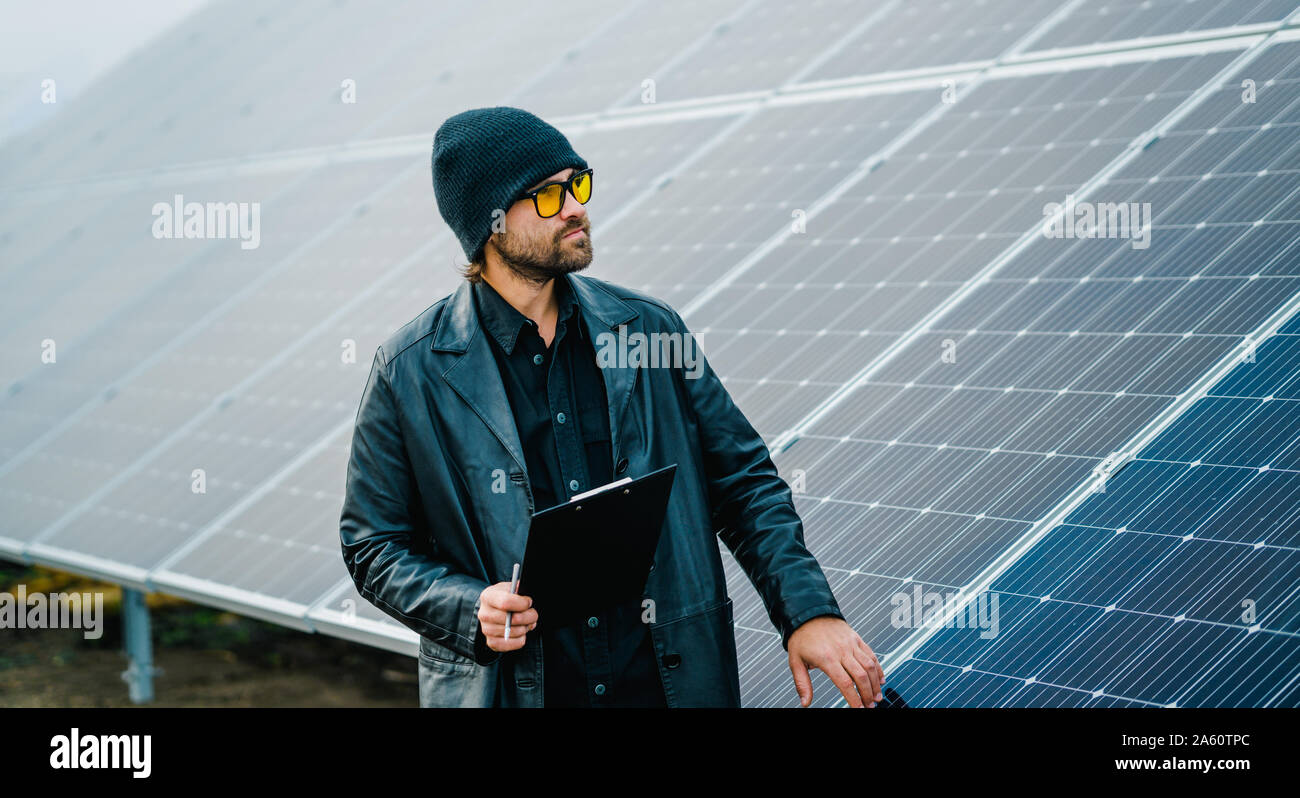 Man hand lay on solar panels Stock Photo - Alamy