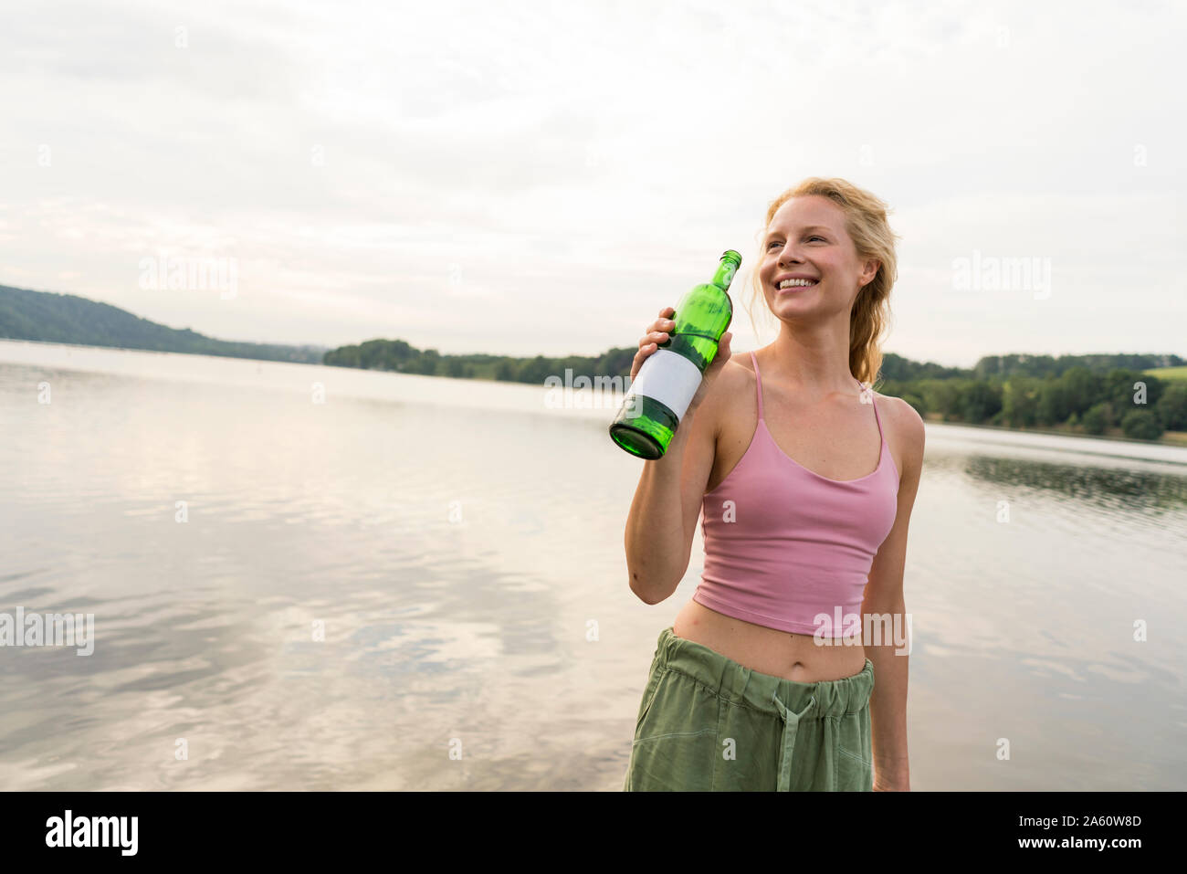 Woman getting a drink of water hi-res stock photography and images - Alamy