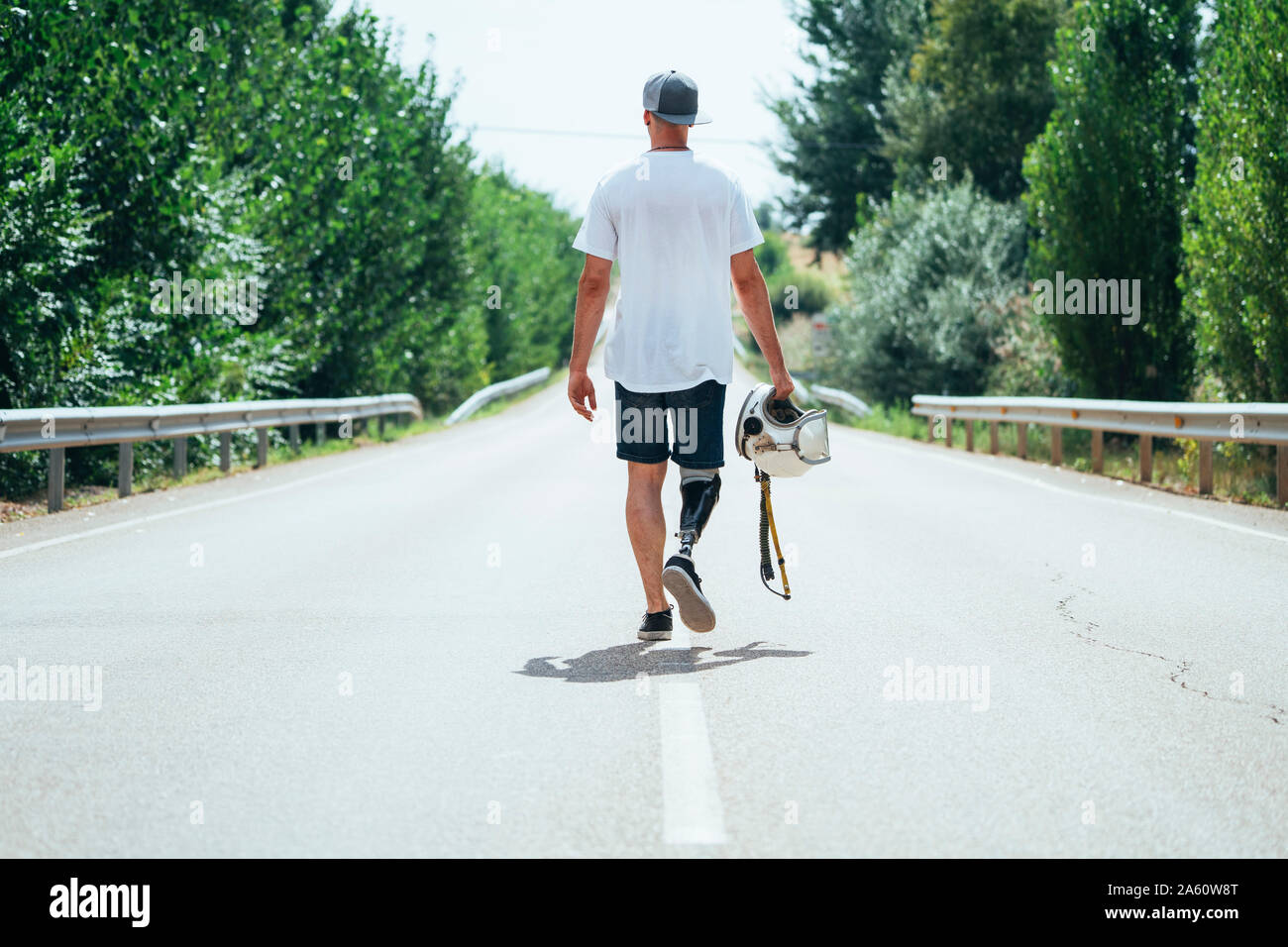 Man walking with helmet hi-res stock photography and images - Alamy