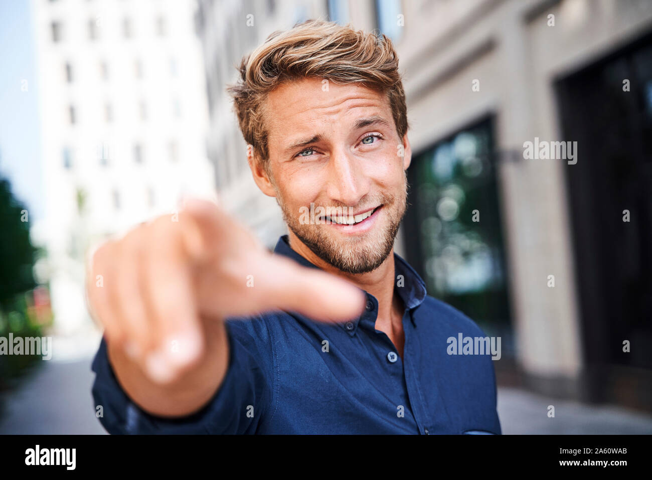 Business man pointing with finger hi-res stock photography and images ...