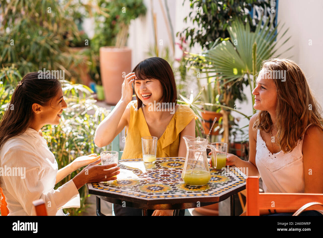 Three friends in the courtyard hi-res stock photography and images - Alamy