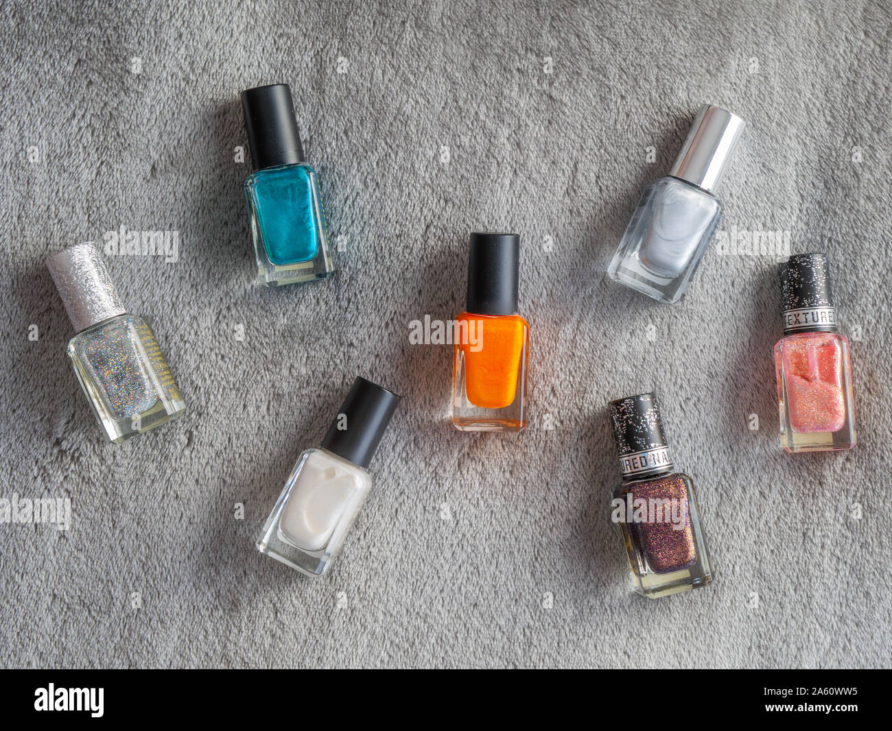 Nail varnish paint bottles displayed on textured background Stock Photo ...