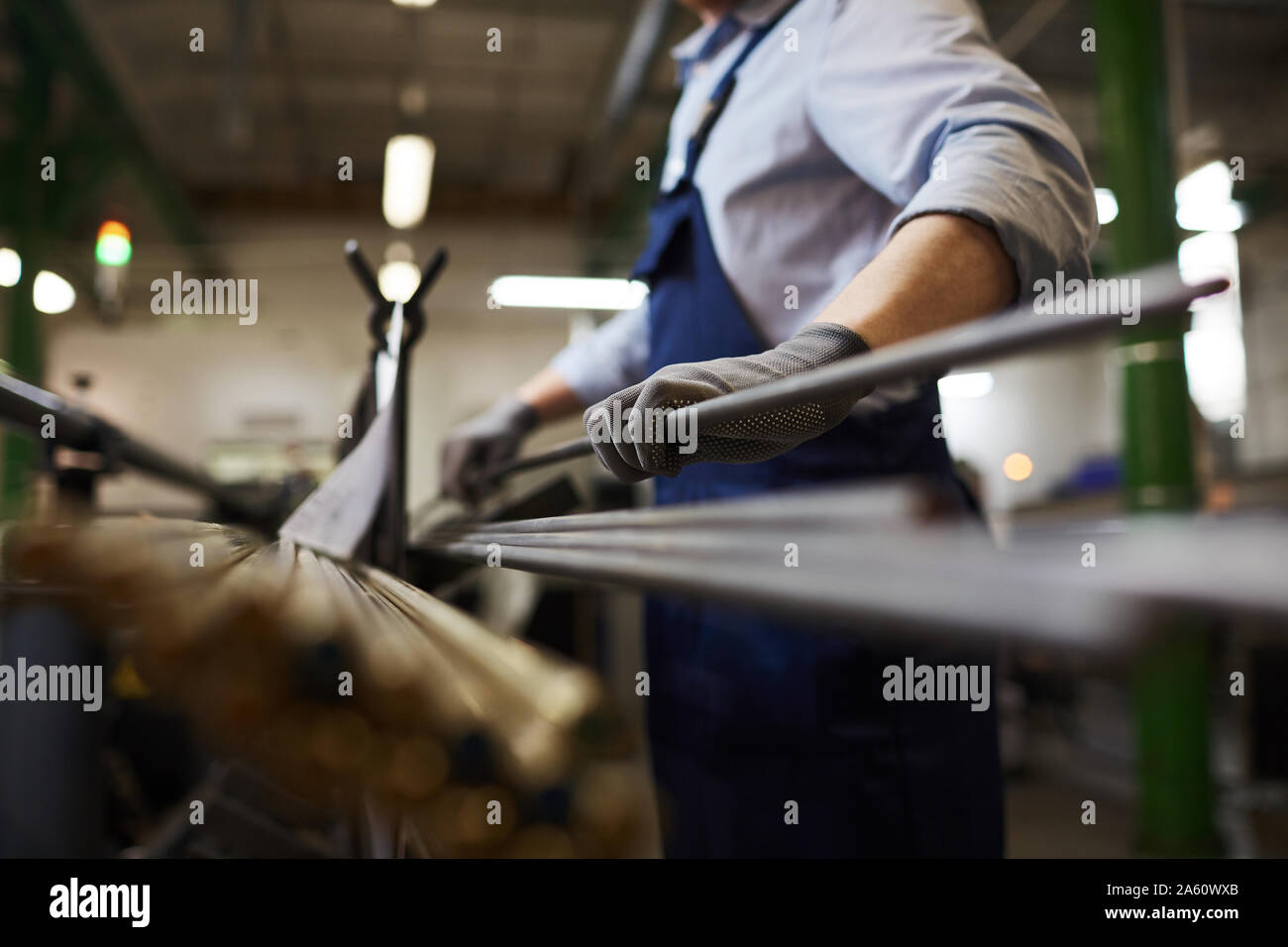 Man holding metal pipe hi-res stock photography and images - Alamy