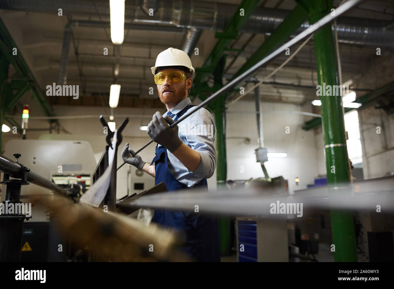 Factory worker wearing gloves hi-res stock photography and images - Alamy