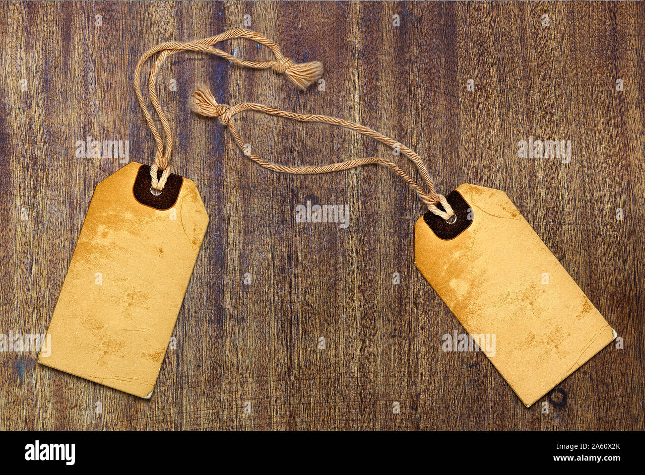 Two natural label tags on Black textured granite slate Stock Photo - Alamy
