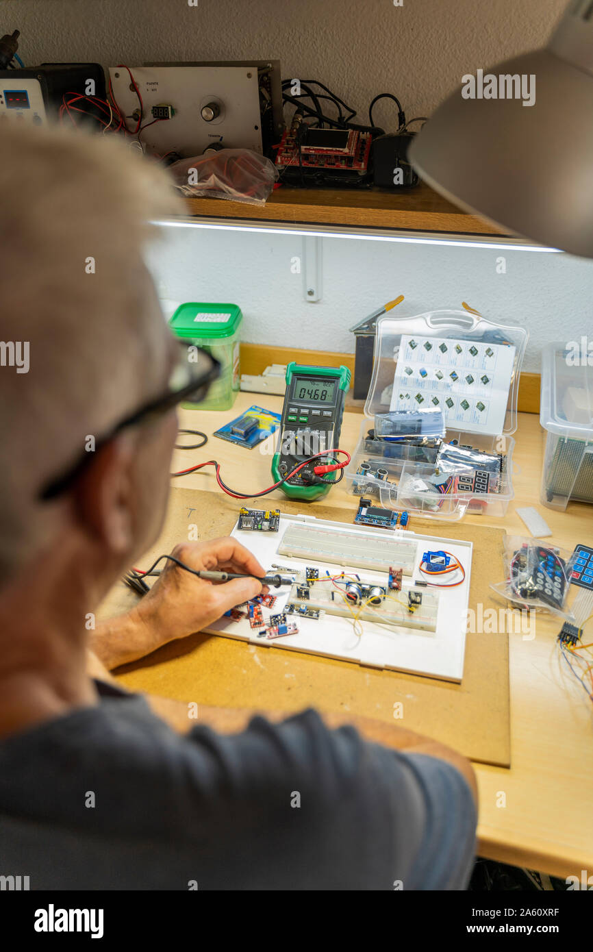 Working on electronic circuit hi-res stock photography and images - Alamy