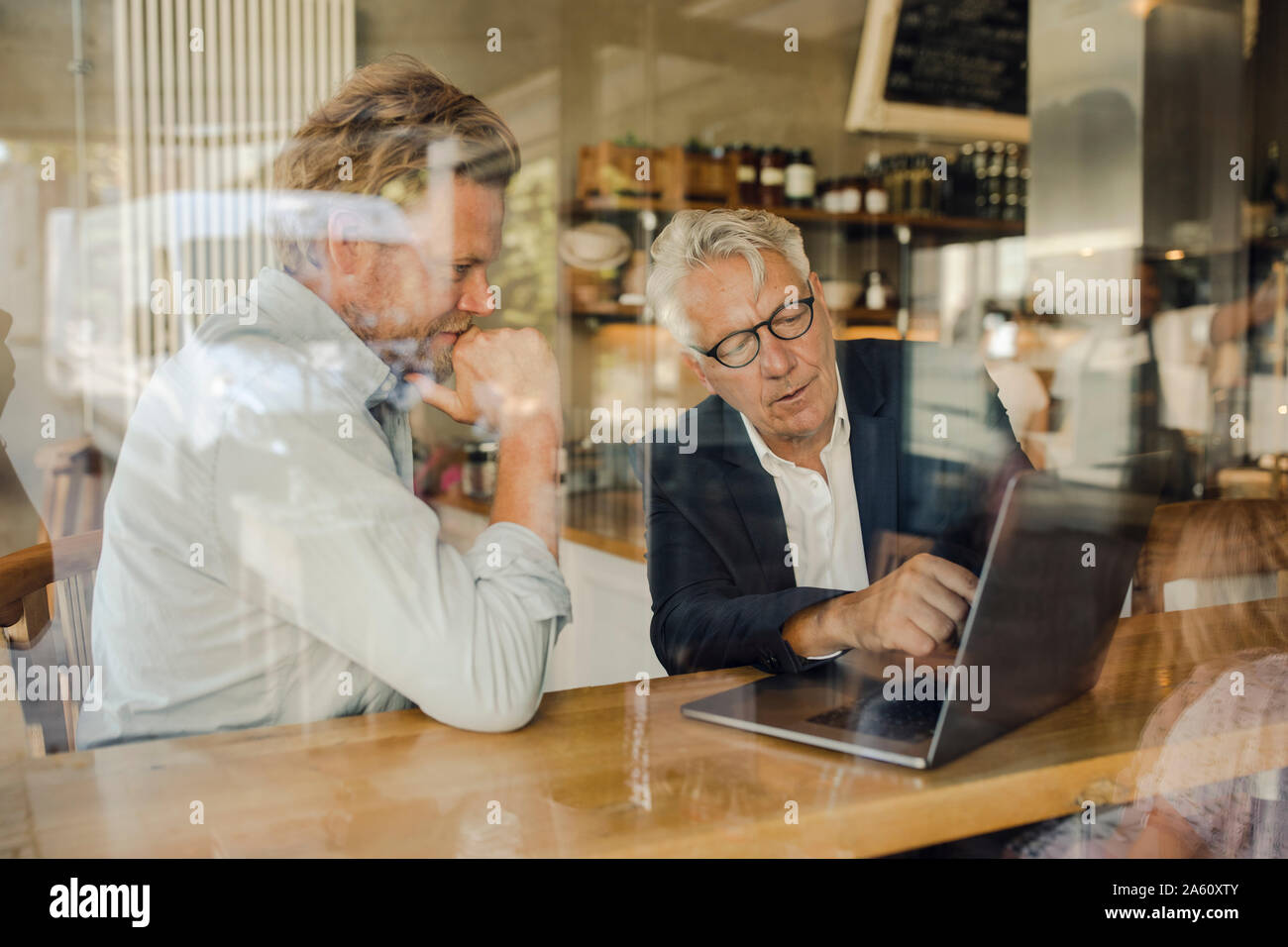 Two men at a cafe hi-res stock photography and images - Alamy