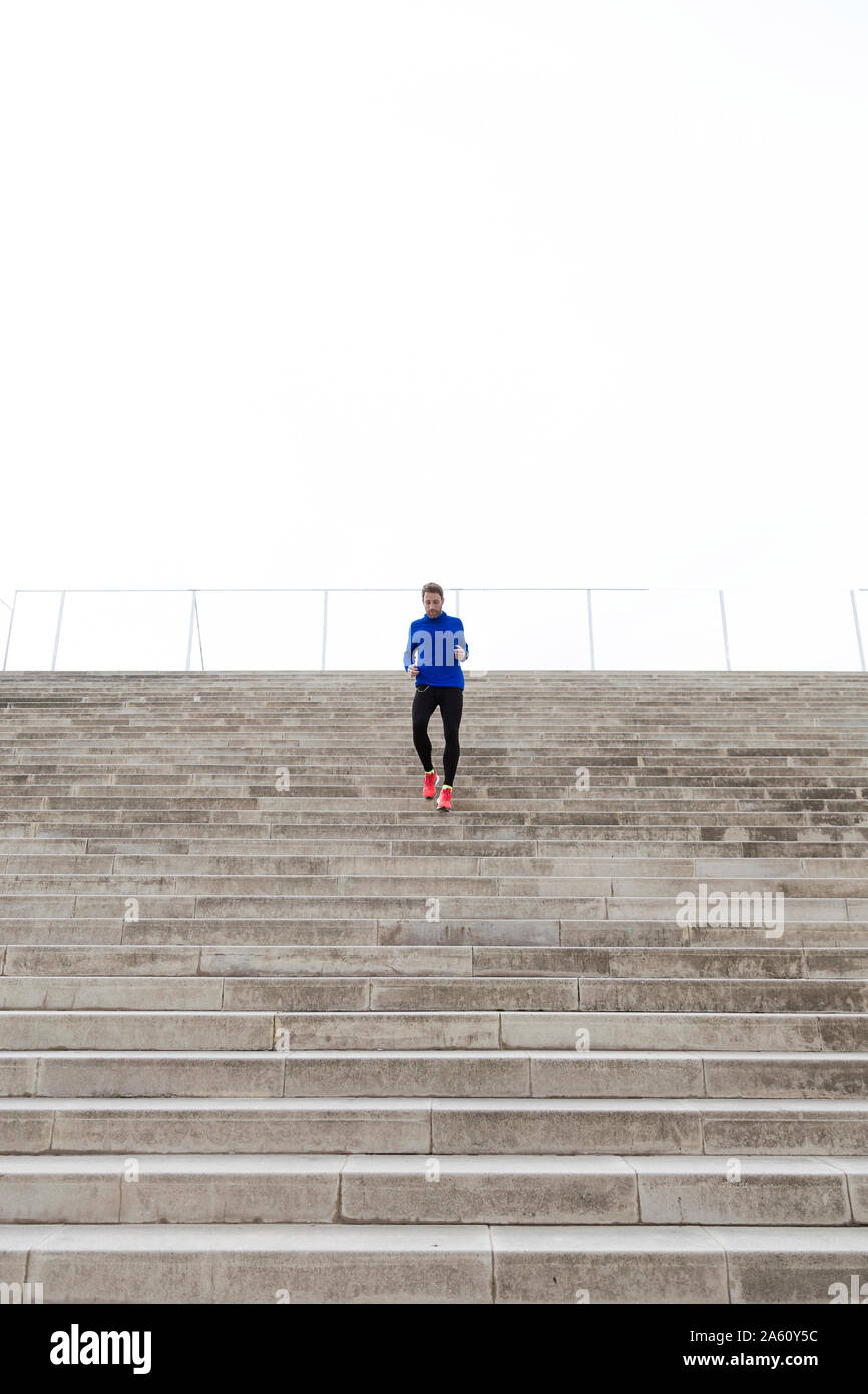 Jogger running on steps Stock Photo - Alamy