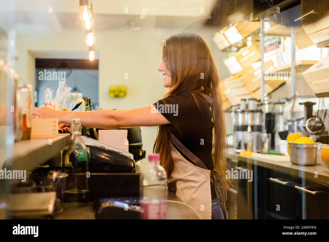 Barista behind cafe counter hi-res stock photography and images - Alamy