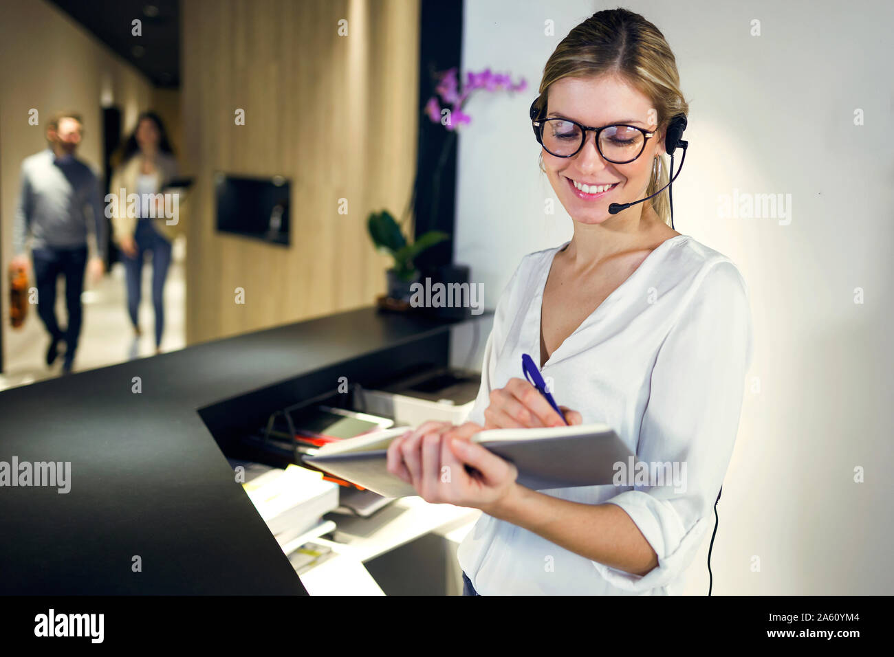 Receptionist hi-res stock photography and images - Alamy