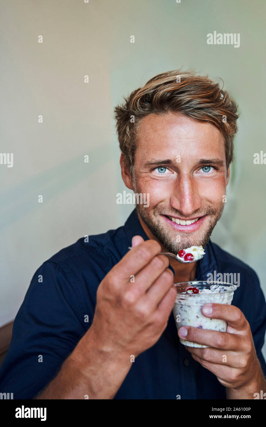Man, happy, eating with spoon hi-res stock photography and images - Alamy