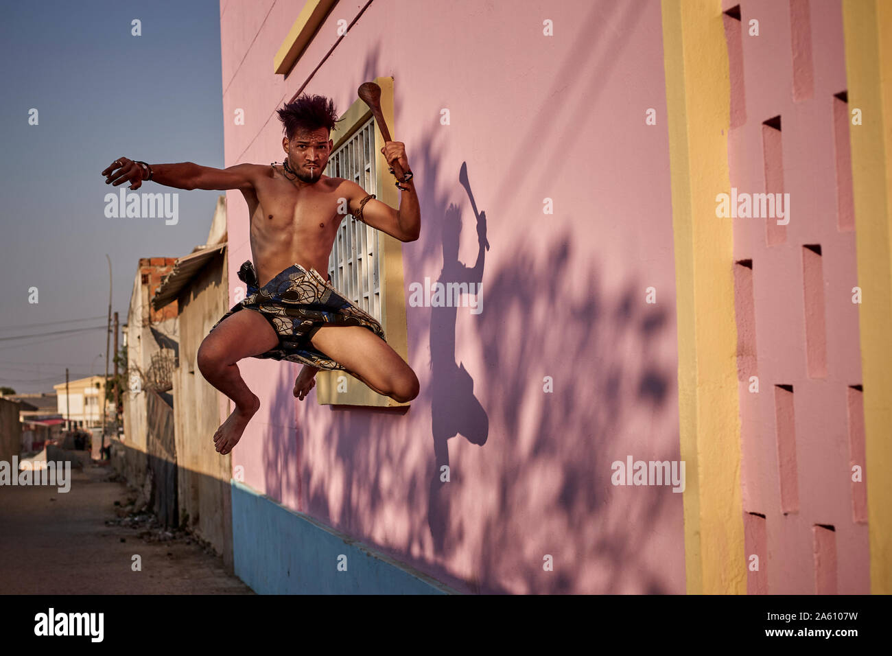 Tribal man with his traditional arch and arrows jumping, Lubango ...