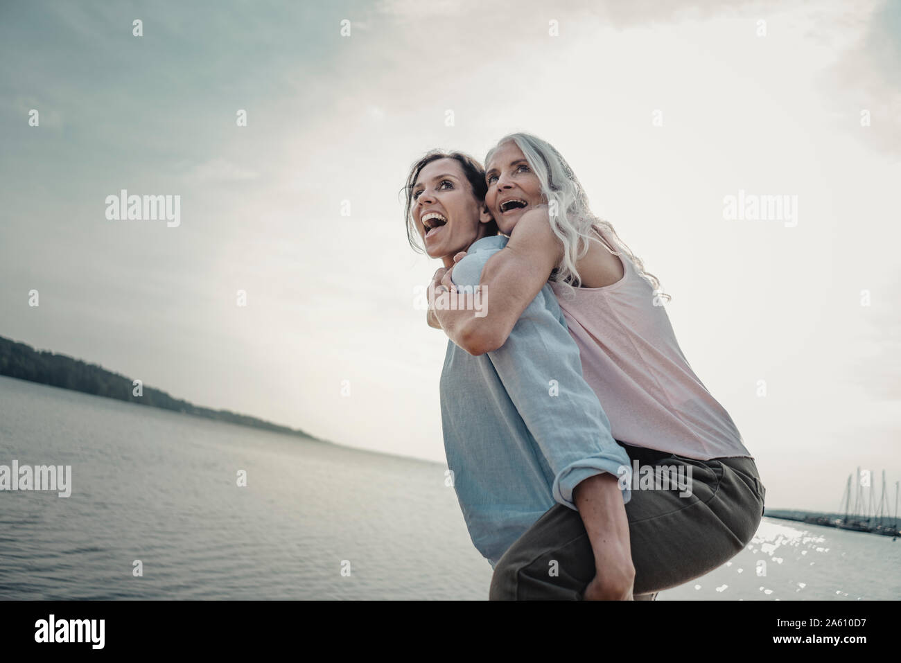 Child on piggyback hi-res stock photography and images - Alamy