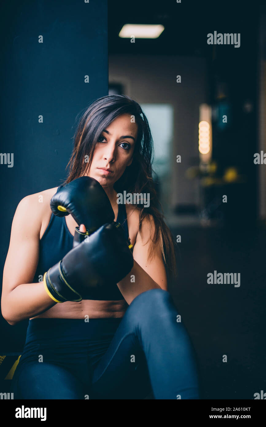 Portrait of a female boxer resting after boxing training Stock Photo ...