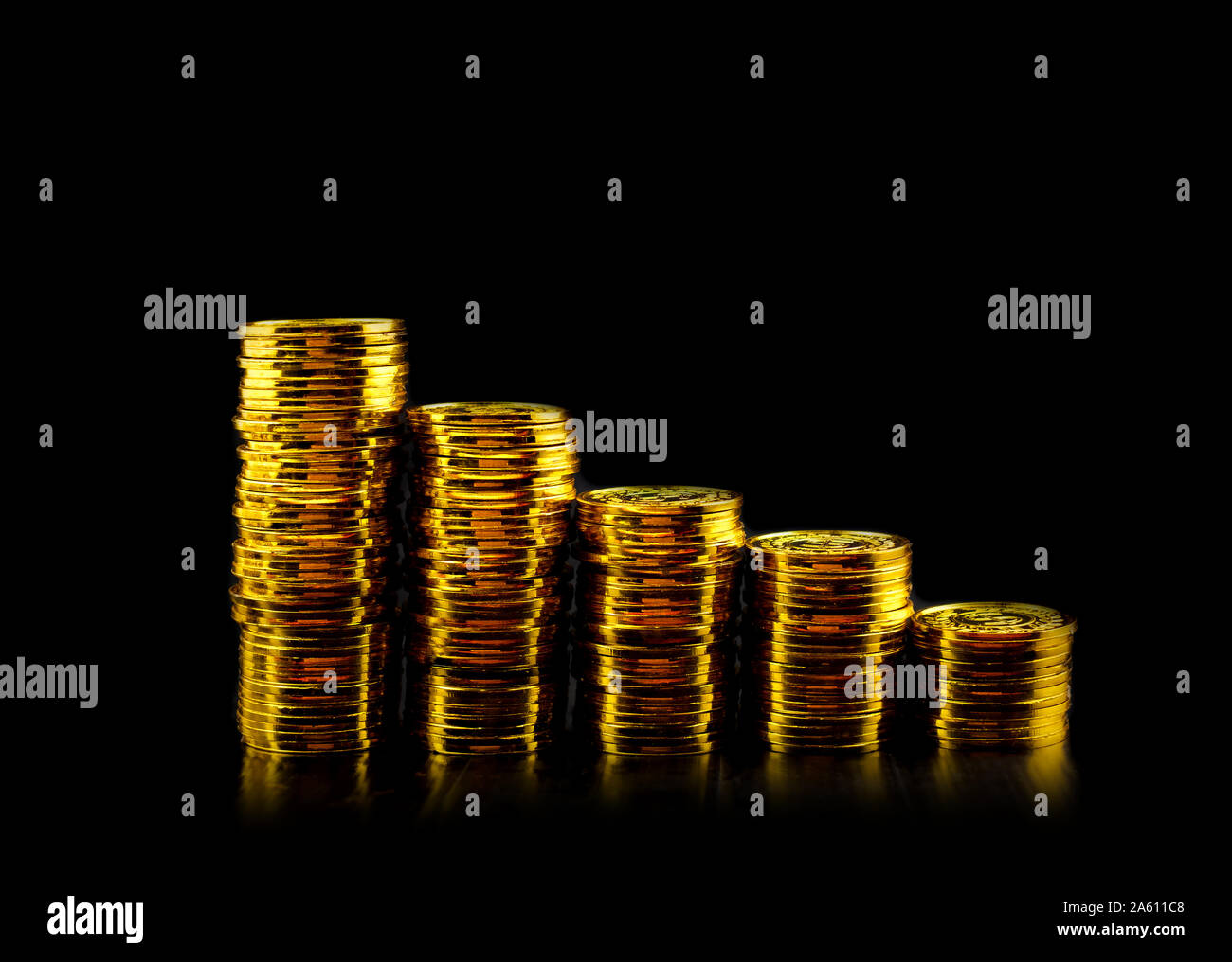 Lots of stacking gold coin at black background Stock Photo - Alamy