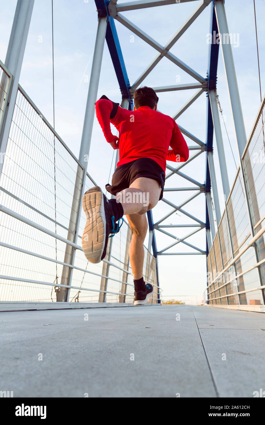 Person running on bridge in hi-res stock photography and images - Alamy