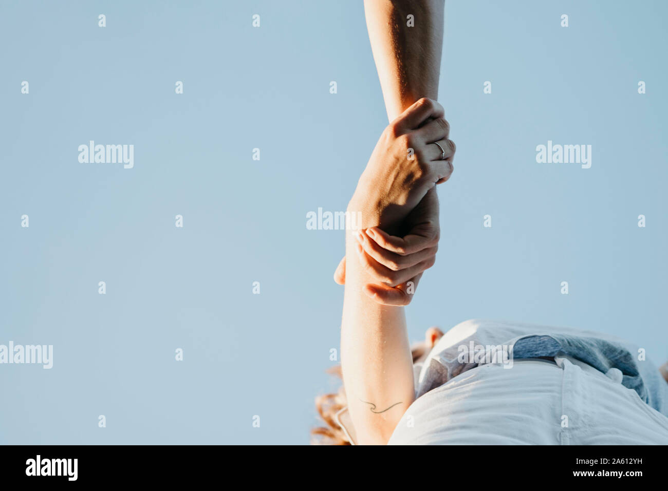 Young couple holding hands, from above Stock Photo - Alamy