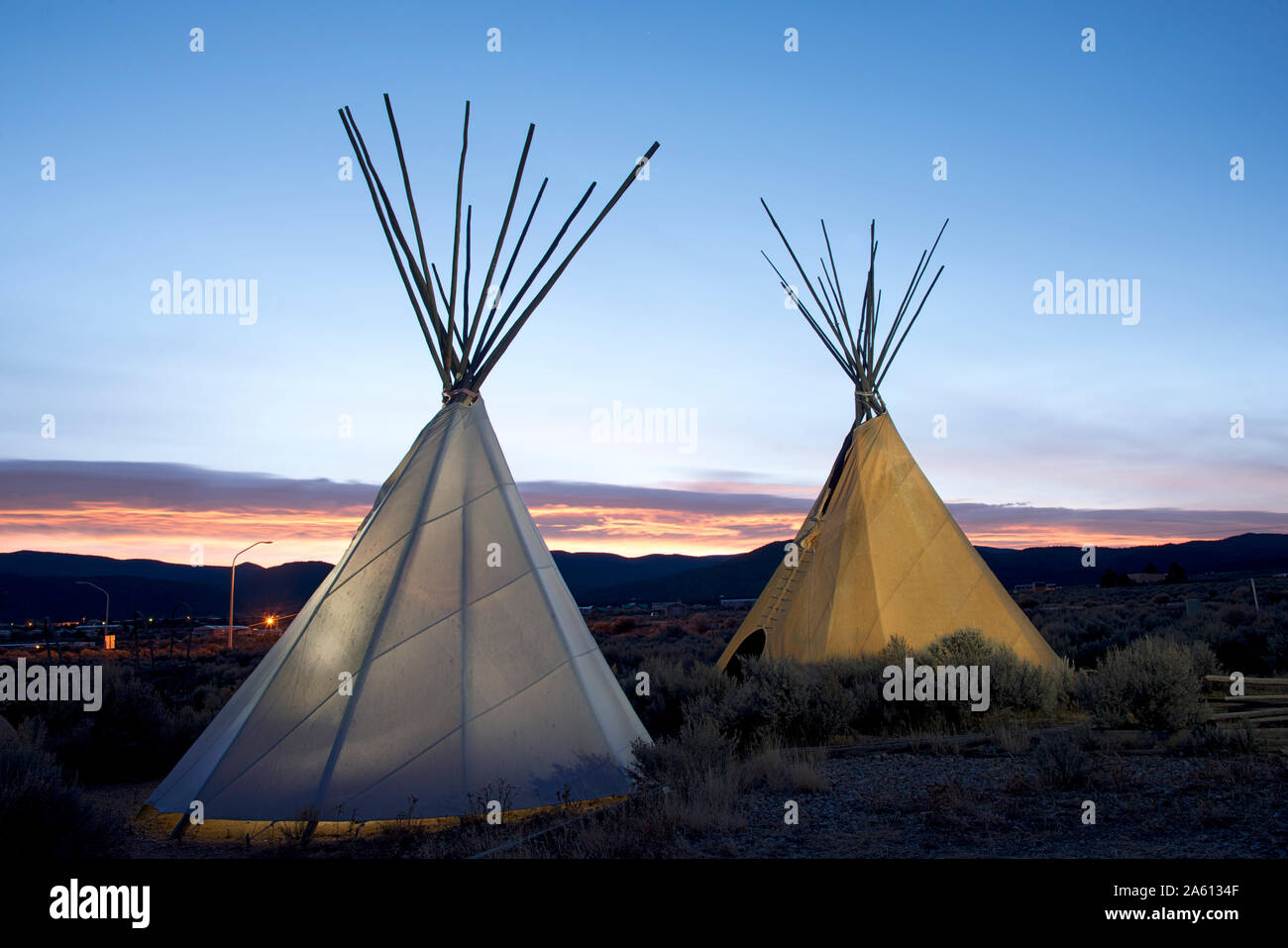 Teepees (tipis) on display at sunset in Taos, New Mexico, United States ...
