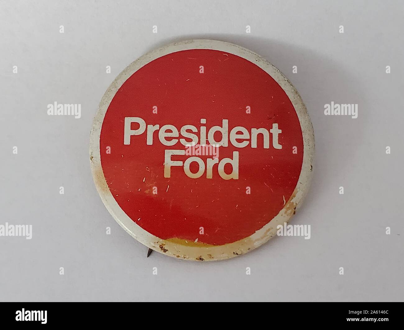 Red and white pin-back button or badge, with the text 'President Ford ...