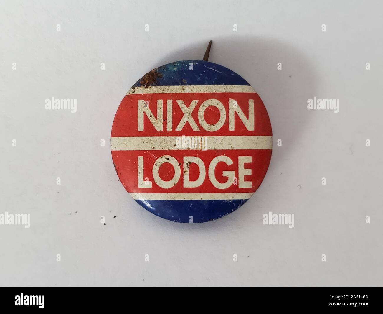 Red, white, and blue pin-back button or badge, with the text 'Nixon ...
