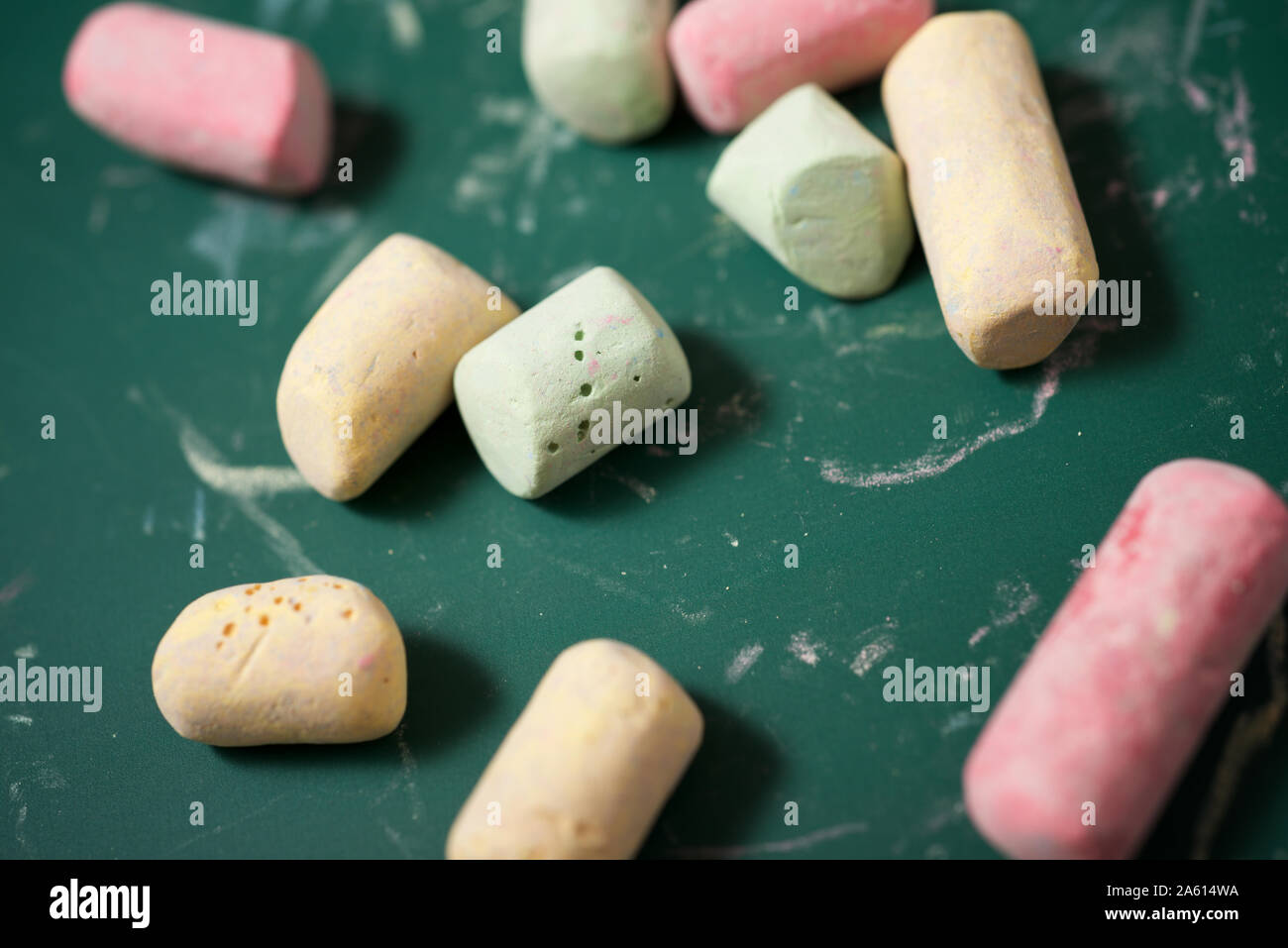 View of a group of chalks and a green blackboard Stock Photo - Alamy