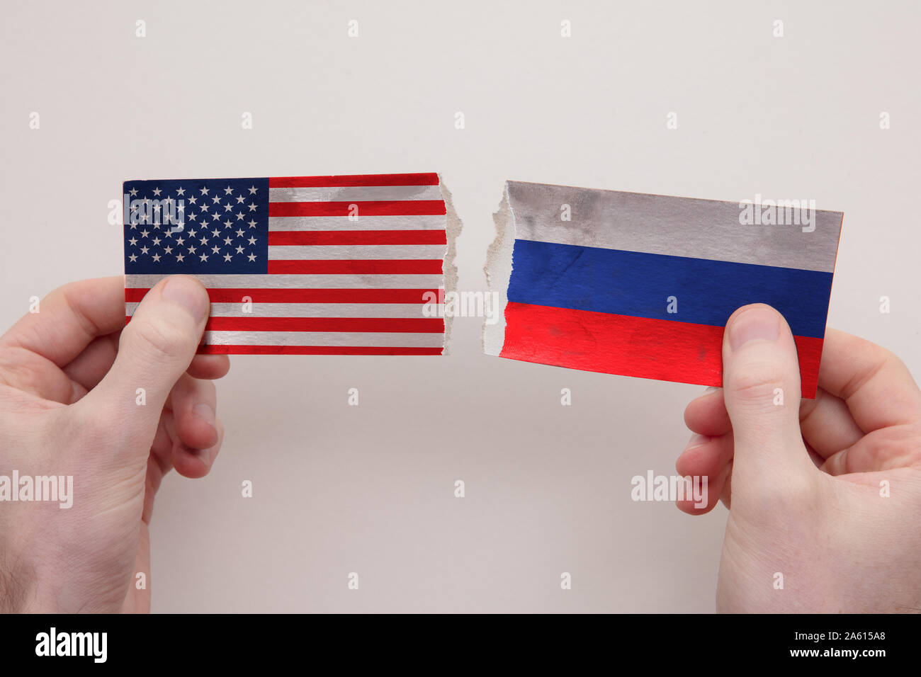 USA and Russia paper flags ripped apart. political relationship concept ...