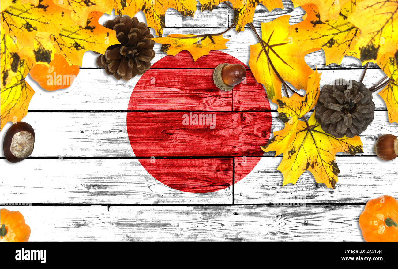 Japan flag on autumn wooden background with leaves and good place for ...