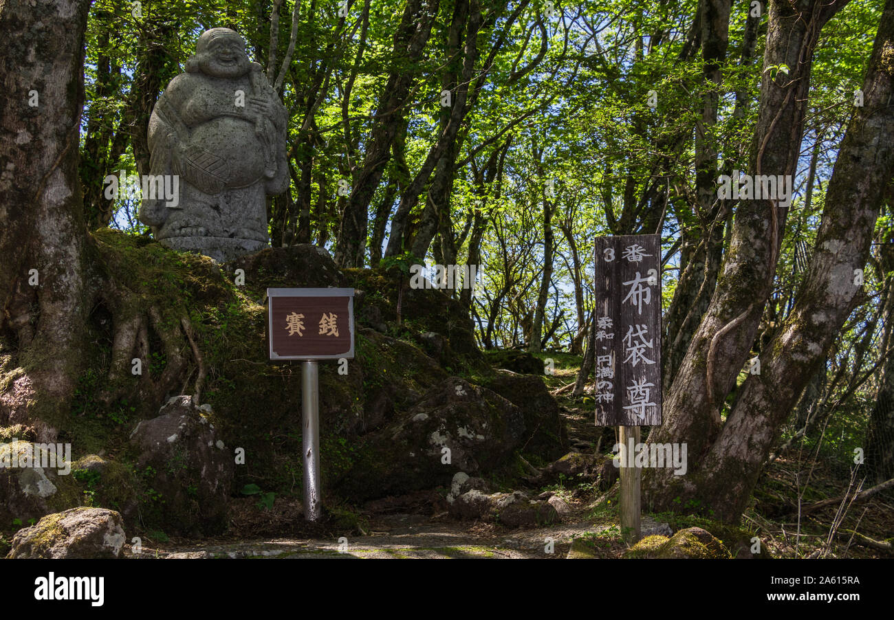 Buddha Statue Number 3 with explanation sign of the Buddha Path on the ...