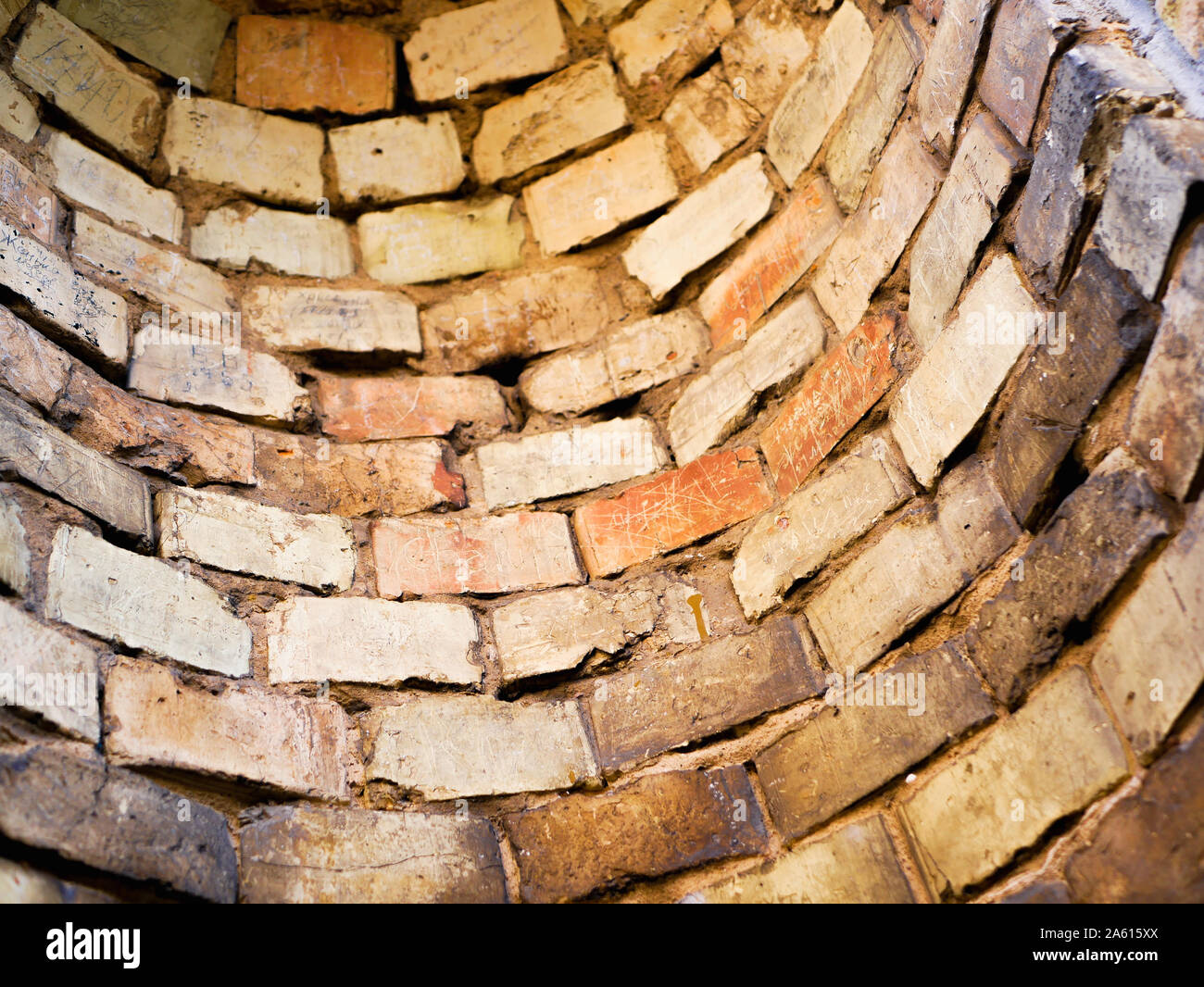 round old brick wall. Inside view of an old brick industrial pipe ...