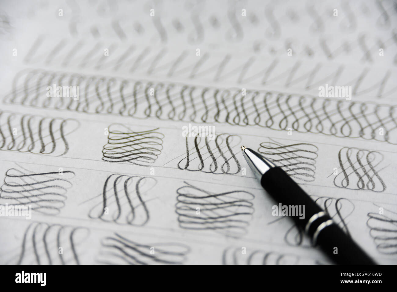Handwriting calligraphy sheets. Design elements and pen close up ...