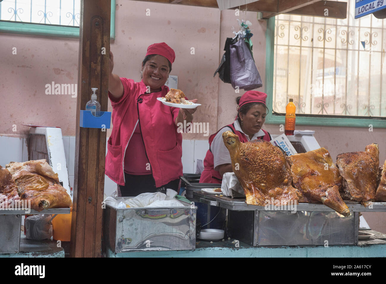 "Hornado" roast pork sellers in La Merced Market, Riobamba, Ecuador ...