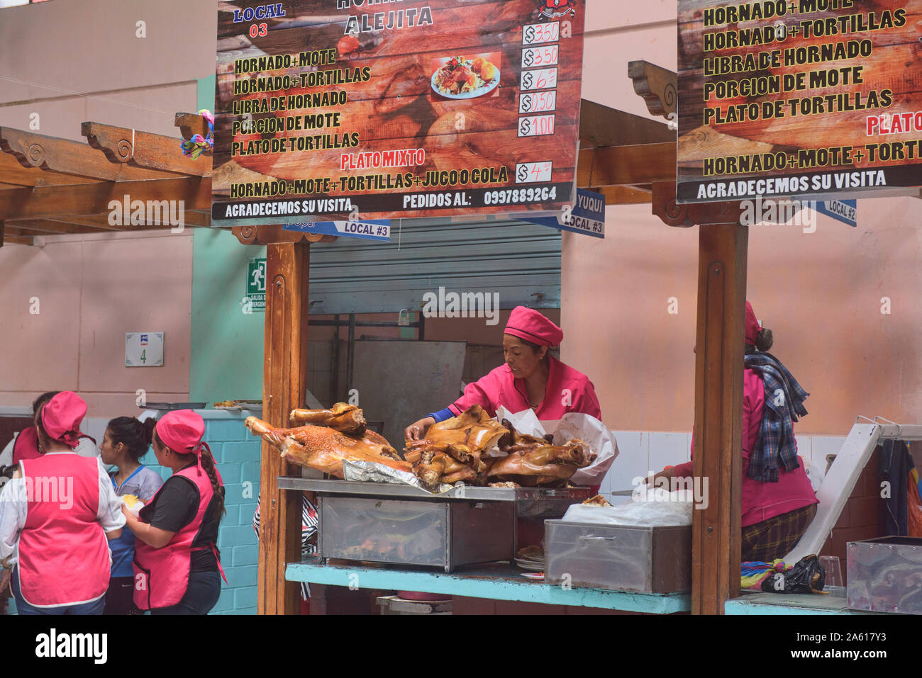 "Hornado" roast pork sellers in La Merced Market, Riobamba, Ecuador ...