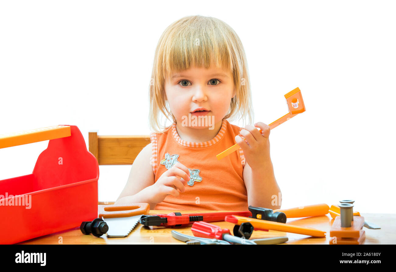 cute little kid with toy tools isolated on a white background Stock ...