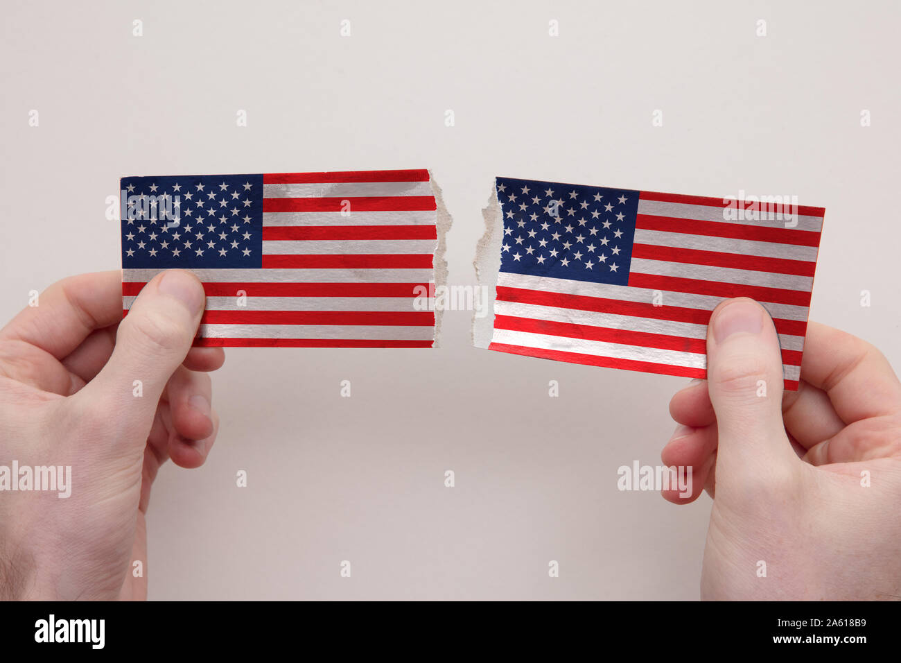 USA and USA paper flags ripped apart. political relationship concept ...