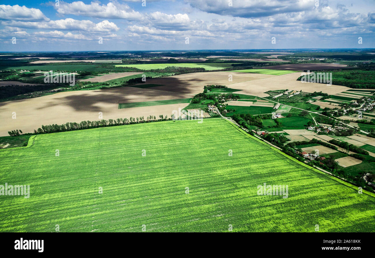 beautiful green field with village, view from height Stock Photo - Alamy