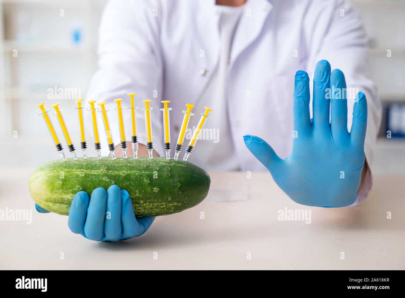 The male nutrition expert testing vegetables in lab Stock Photo - Alamy
