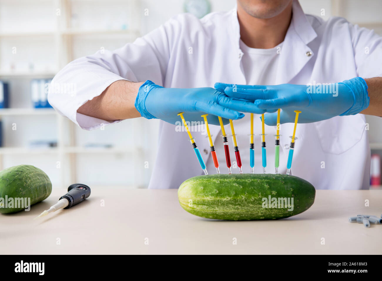 The male nutrition expert testing vegetables in lab Stock Photo - Alamy