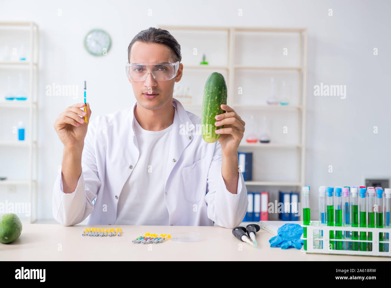 The male nutrition expert testing vegetables in lab Stock Photo - Alamy