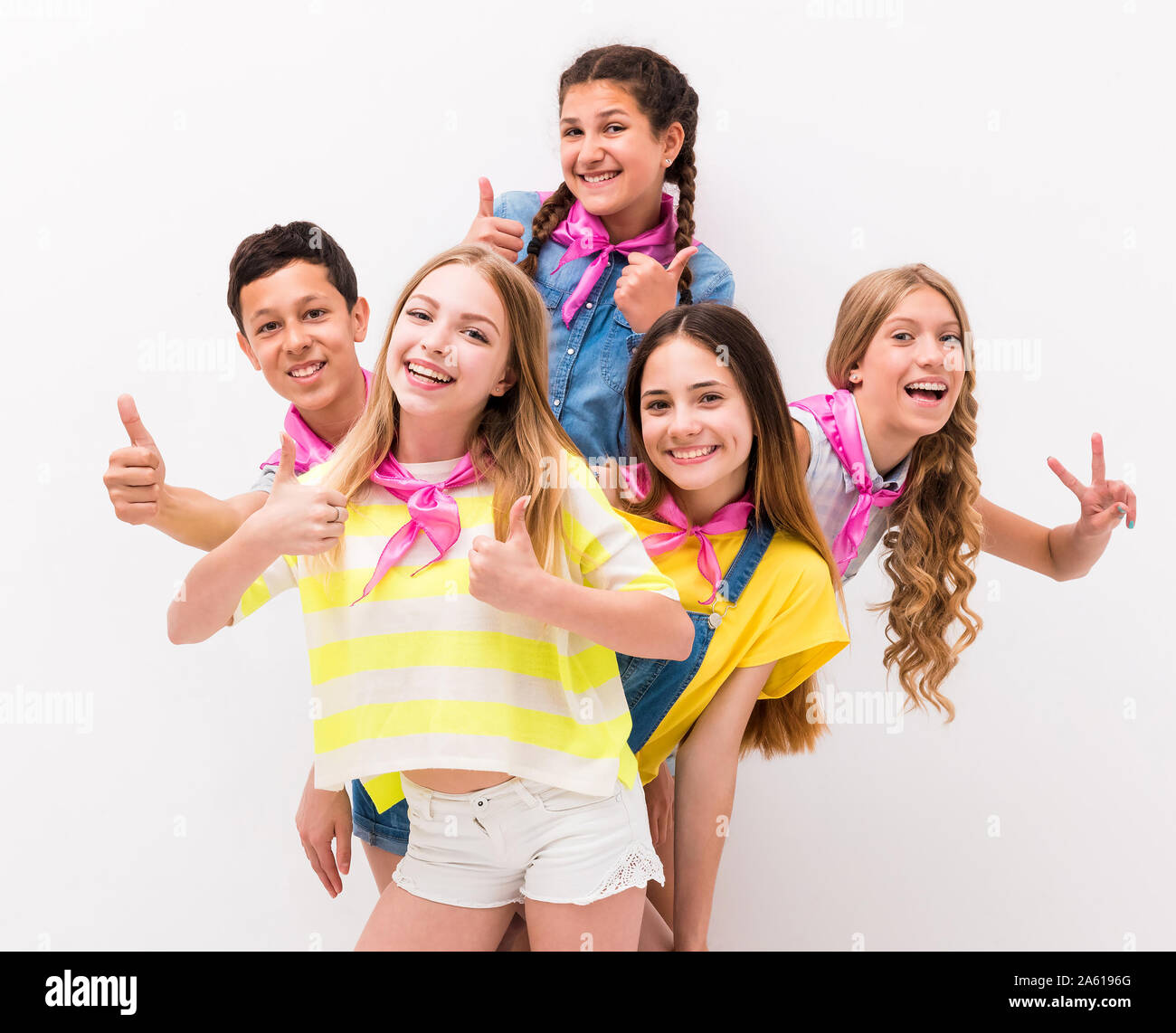 funny teenagers standing behind each other with gestures of peace Stock ...