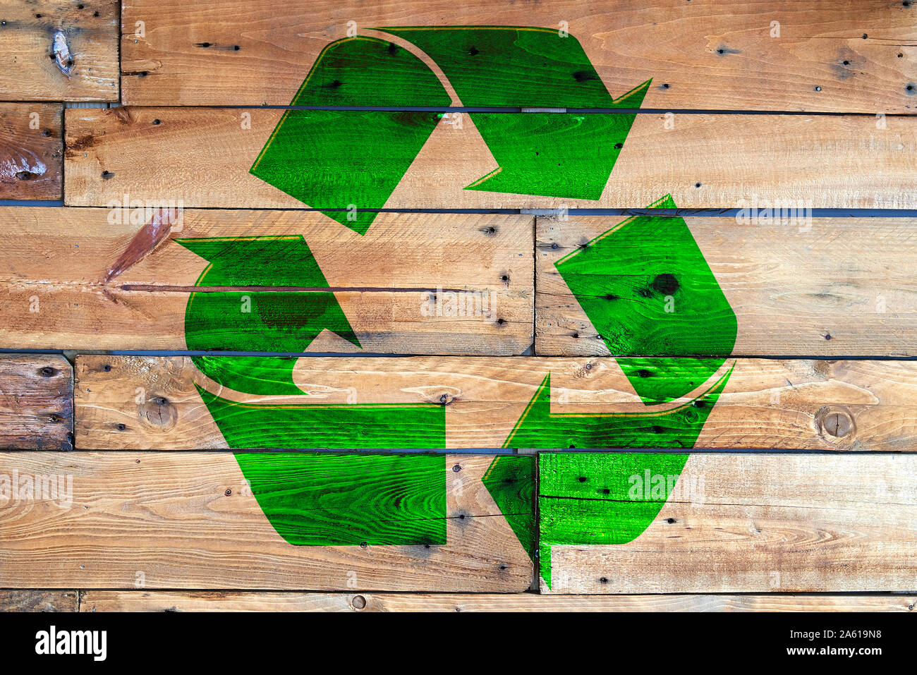 Recycling symbol on wooden table view from above Stock Photo - Alamy