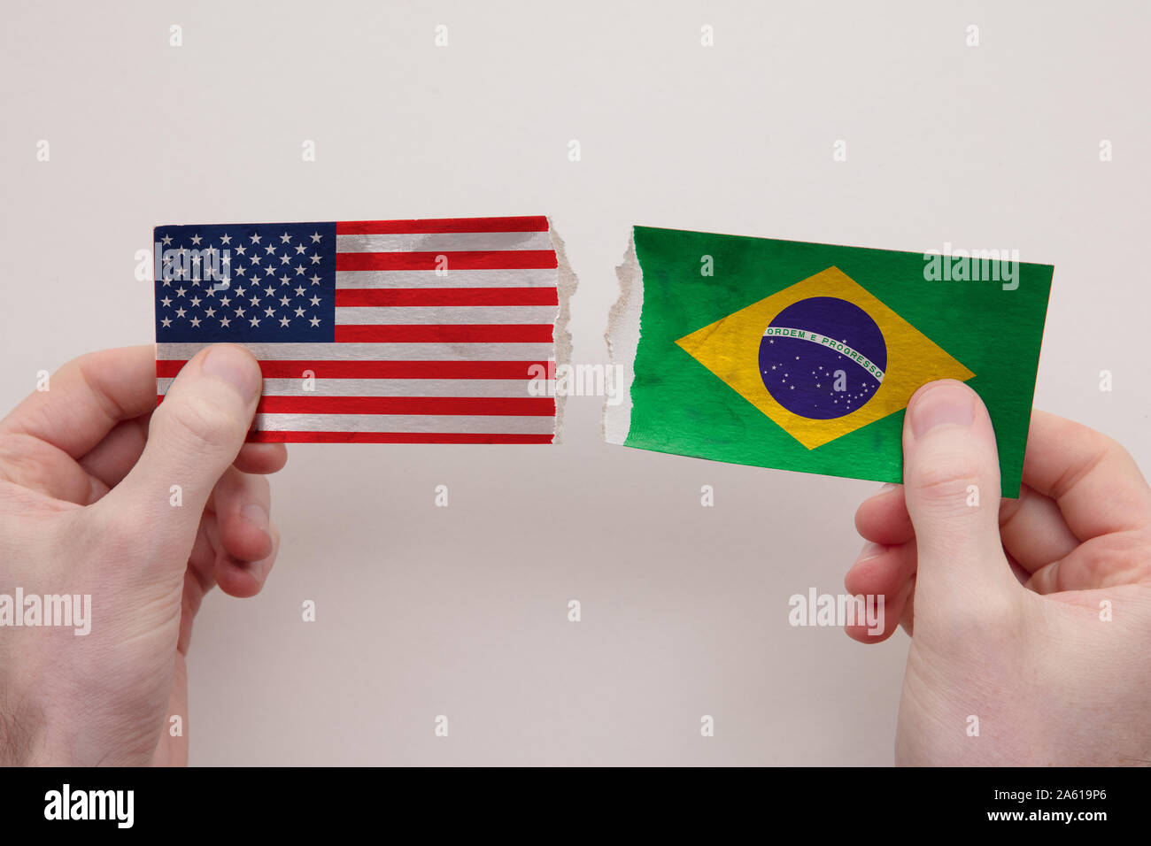 USA and Brazil paper flags ripped apart. political relationship concept ...