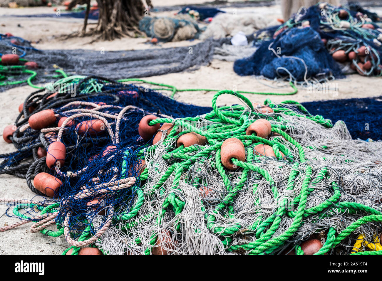 pile of fishing nets with floats and colorful nylon ropes Stock Photo ...