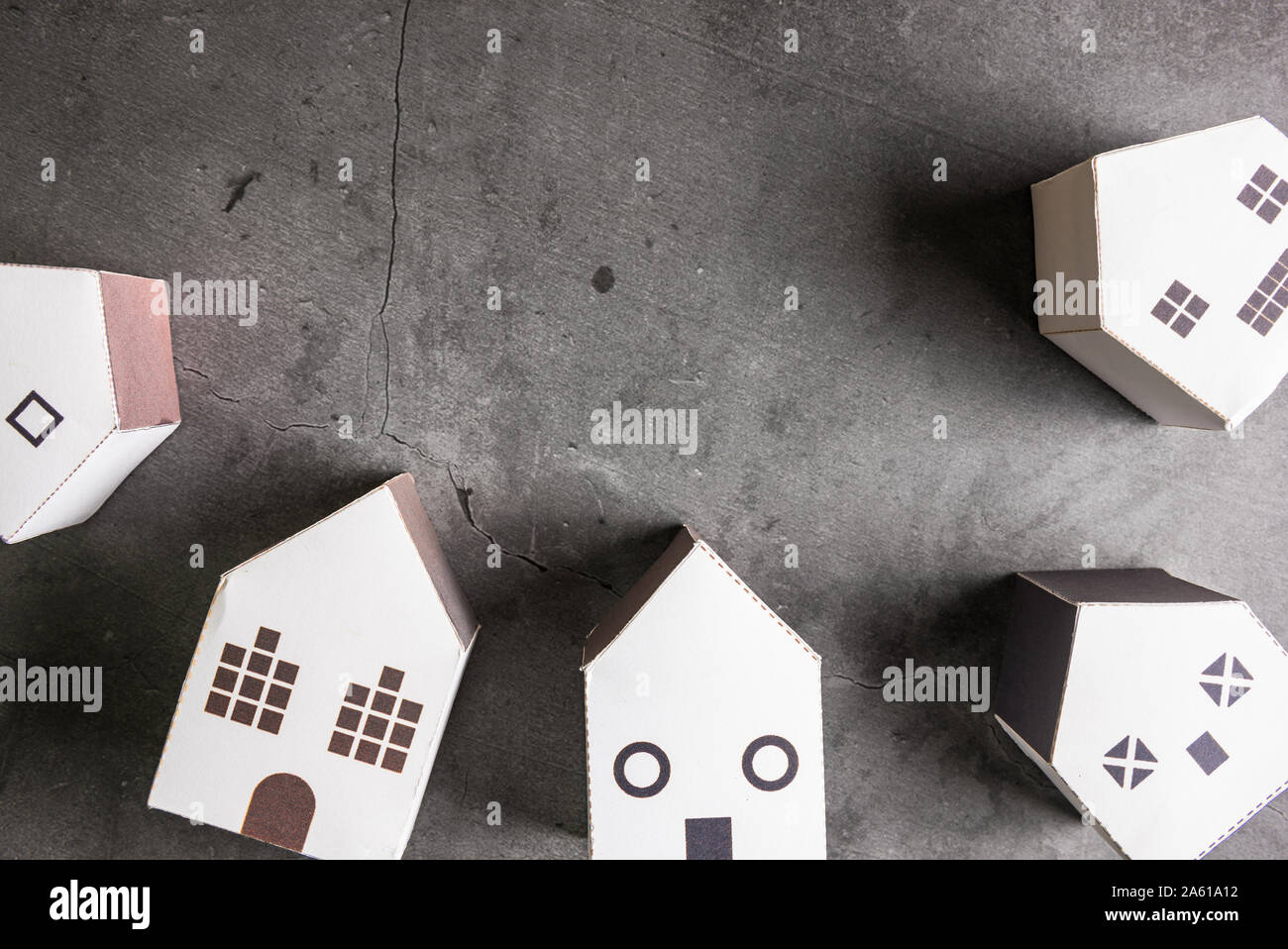 Paper house on stone pattern background with copy space.Home Repair ...