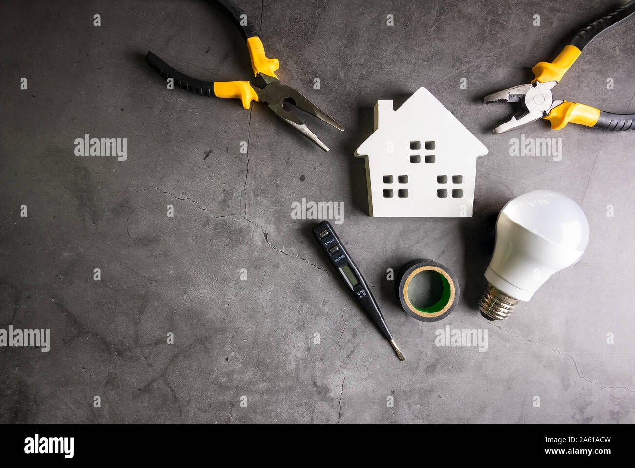 Wooden house and construction tools on stone pattern background with ...