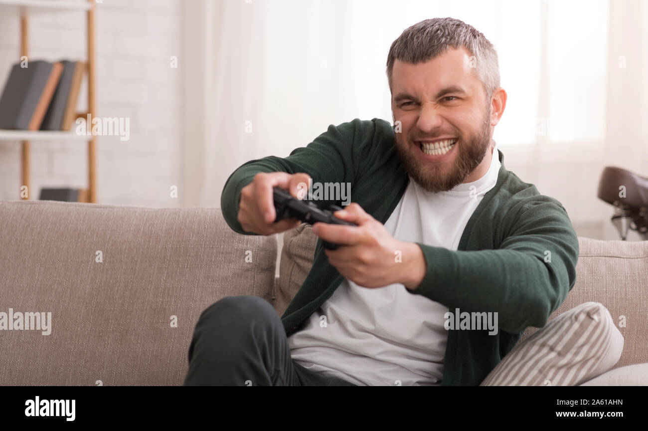 Angry middle aged man sitting hi-res stock photography and images - Alamy