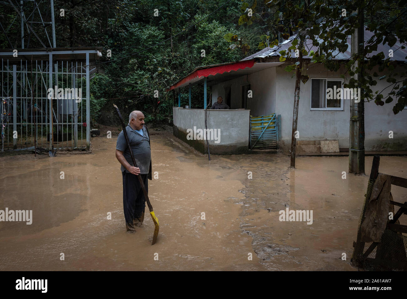 Shaft, Iran. 22nd Oct, 2019. A man stands in the rain at his flooded ...