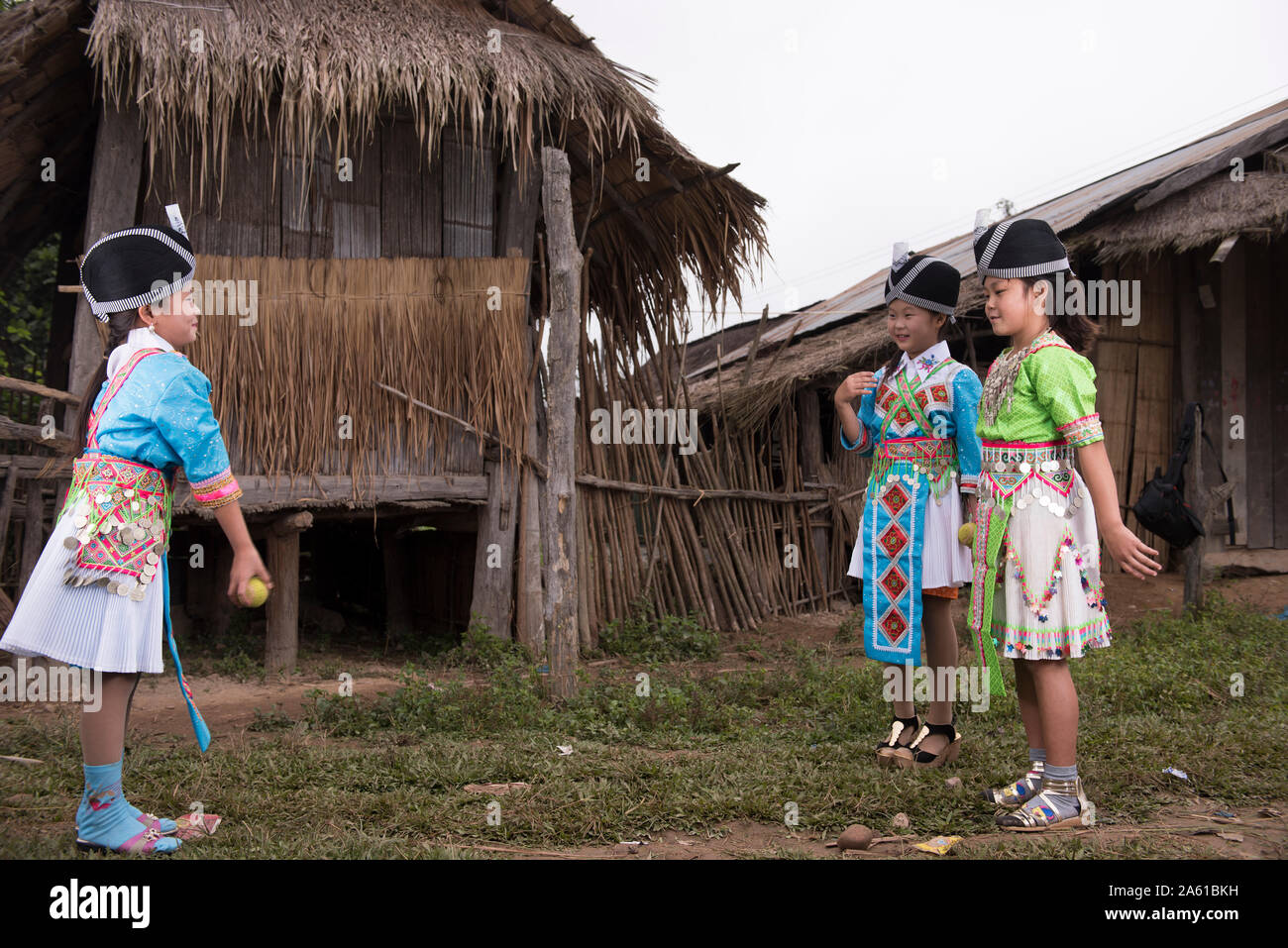 Children enjoy the traditional ball-toss game at the Hmong New Year ...
