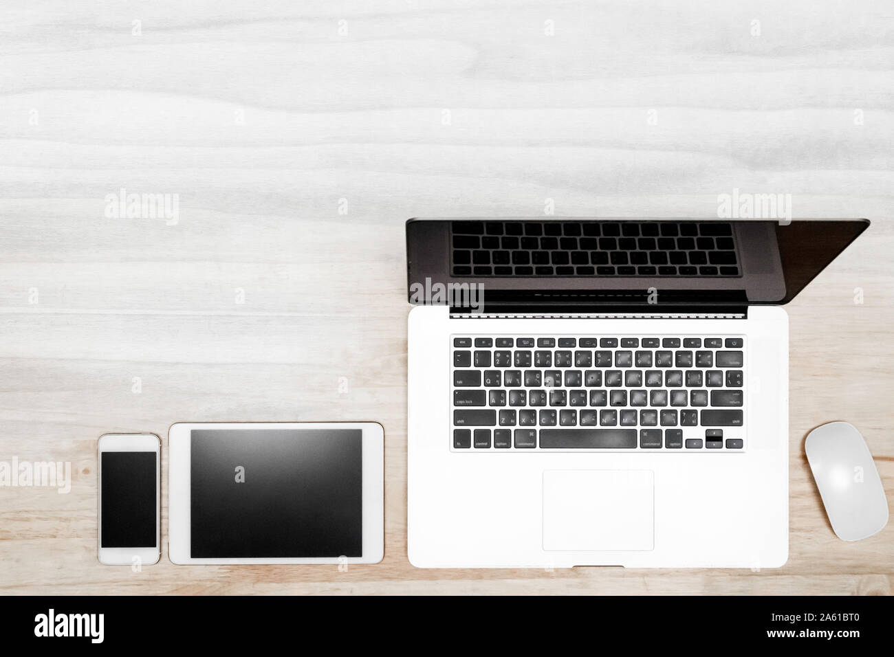 Wood office desk table with laptop, top view flat layout concept. Image blank for copy space ...