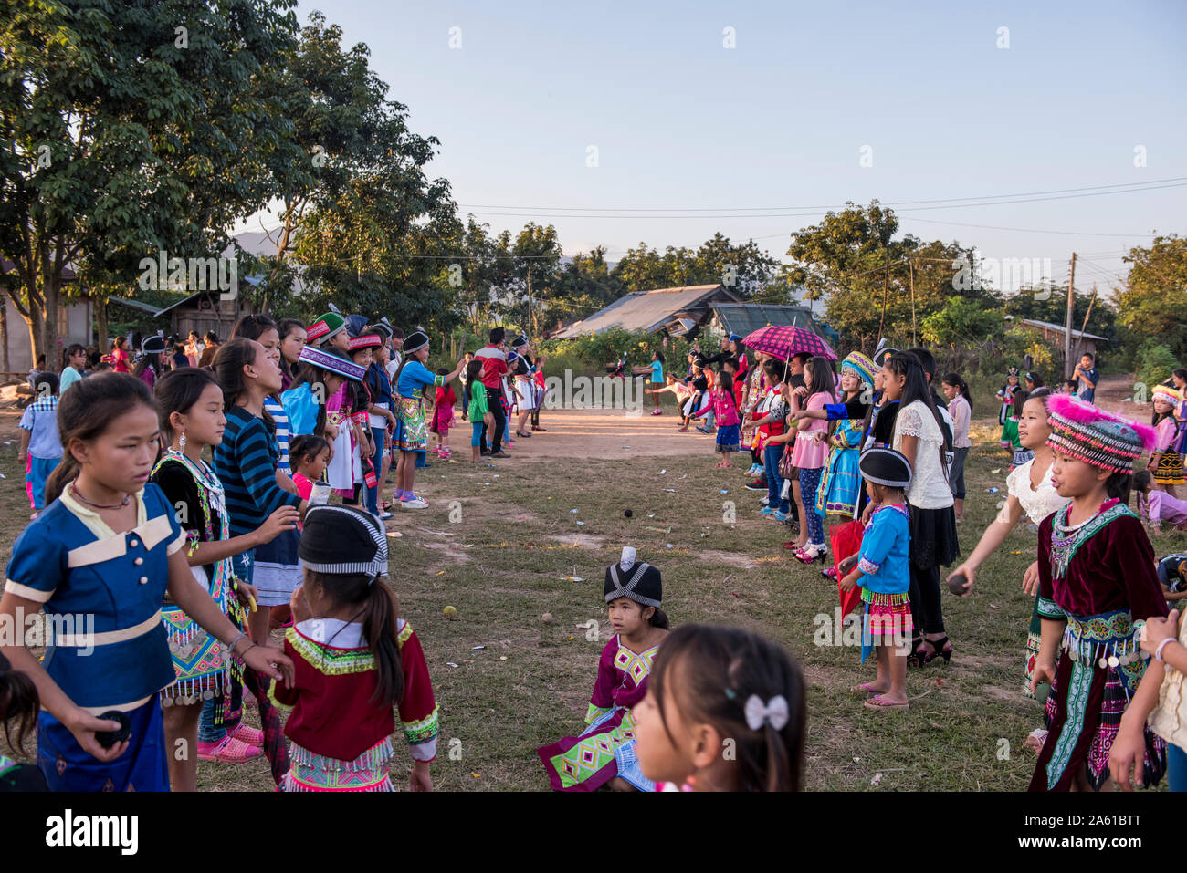 Children enjoy the traditional ball-toss game at the Hmong New Year ...