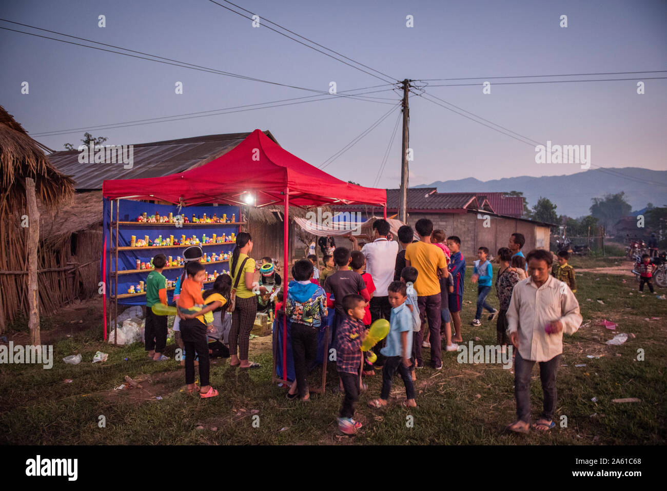 Visitors at the Hmong New Year festival in Muang Sing, Laos, enjoy a ...